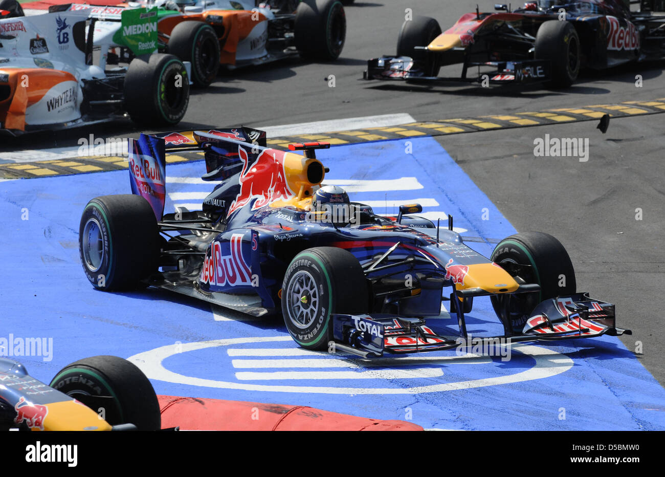 German driver Sebastian Vettel of Red Bull drives his car past a curve ...