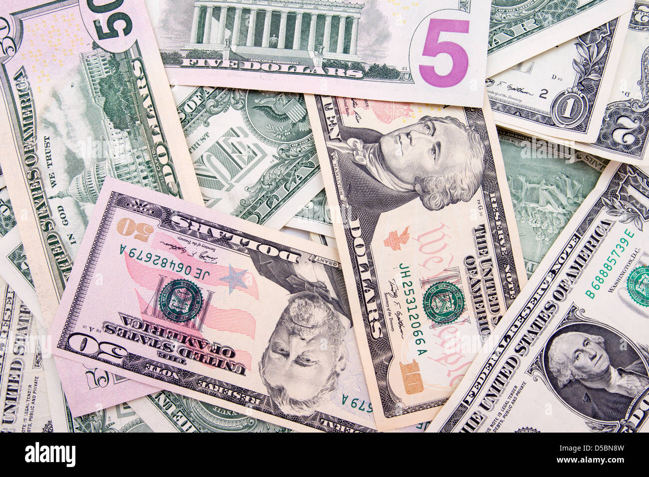 Money background with different american bills Stock Photo - Alamy