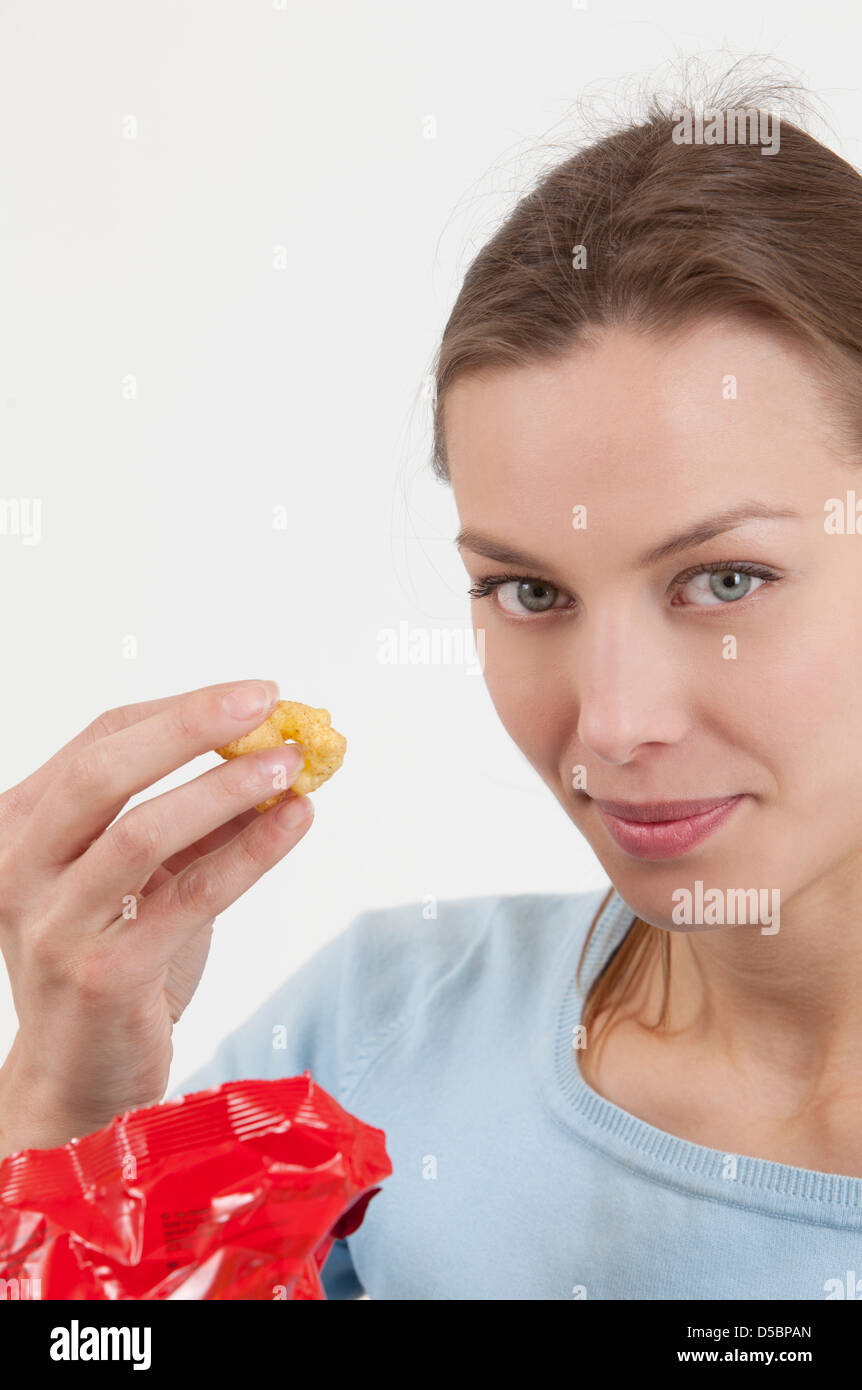woman eating a snack Stock Photo - Alamy