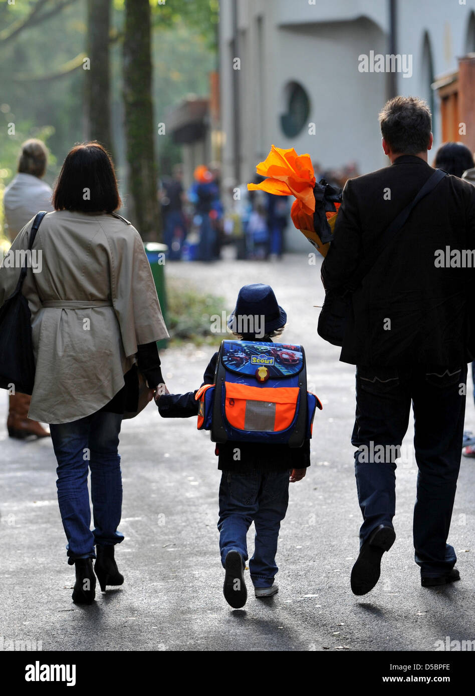 Parents accompany their child to school in Munich, Germany, 14 ...