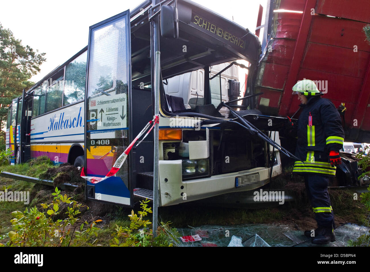 A fireman examines the scene after a Polish lorry that carried tree ...