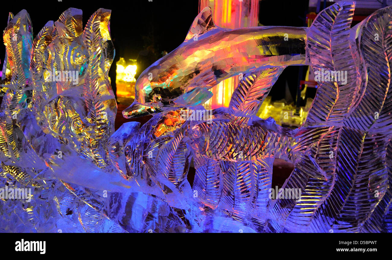 An ice dolphin is illuminated at the Chinese exhibition 'Ice Art' in ...