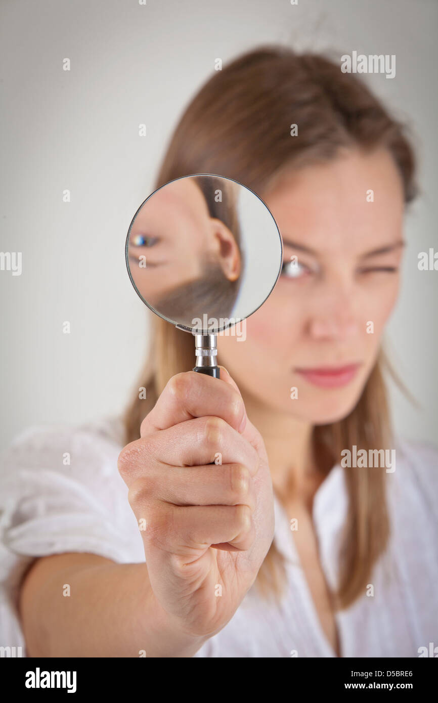 woman with magnifying glass Stock Photo - Alamy
