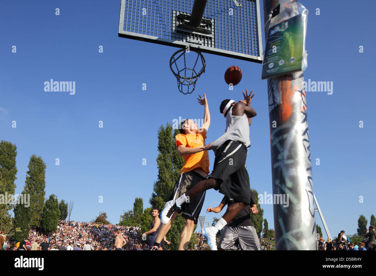 Berlin, Germany, young men playing basketball in the park wall Stock ...