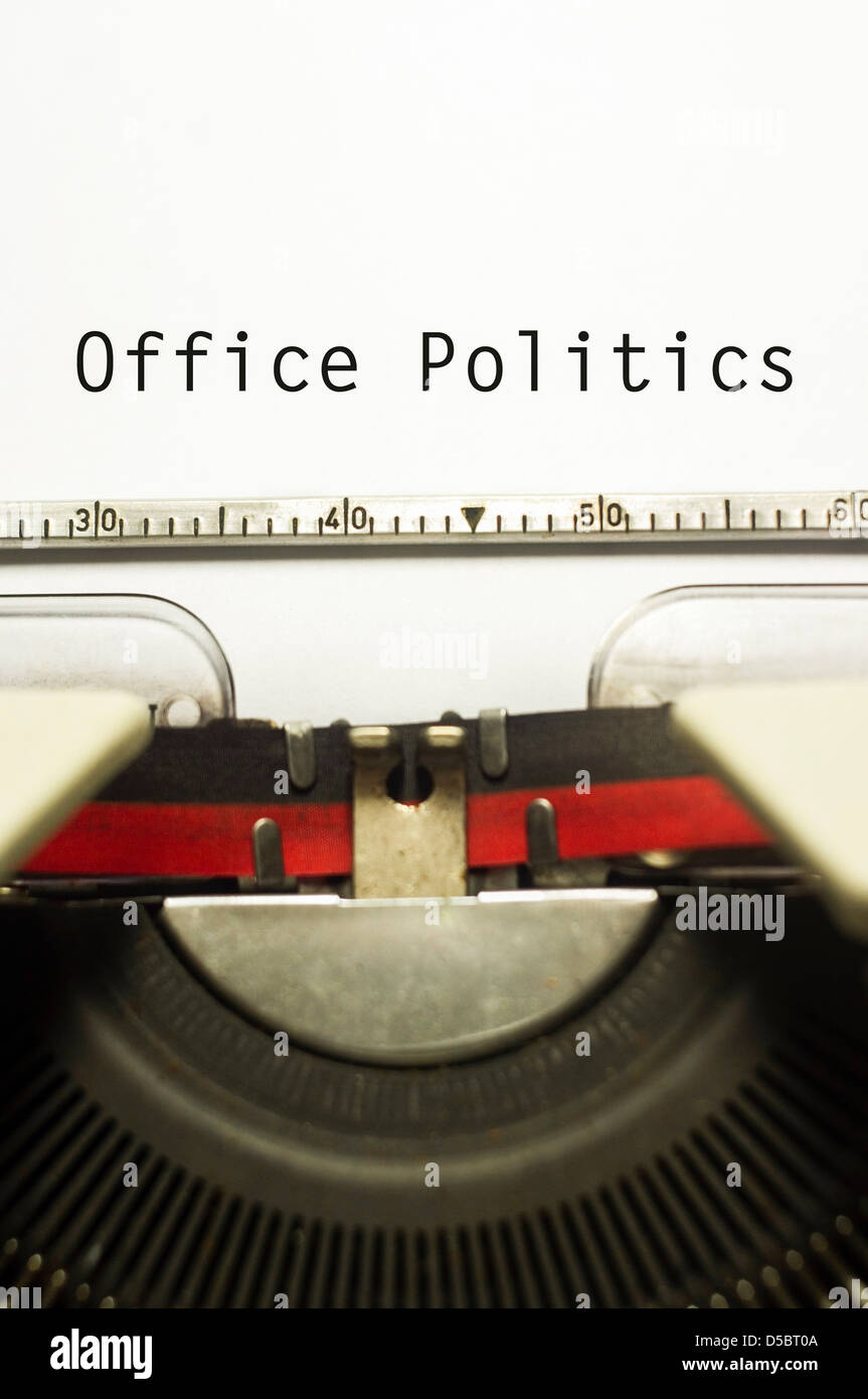 office politics, message on typewriter for conceptual background Stock ...