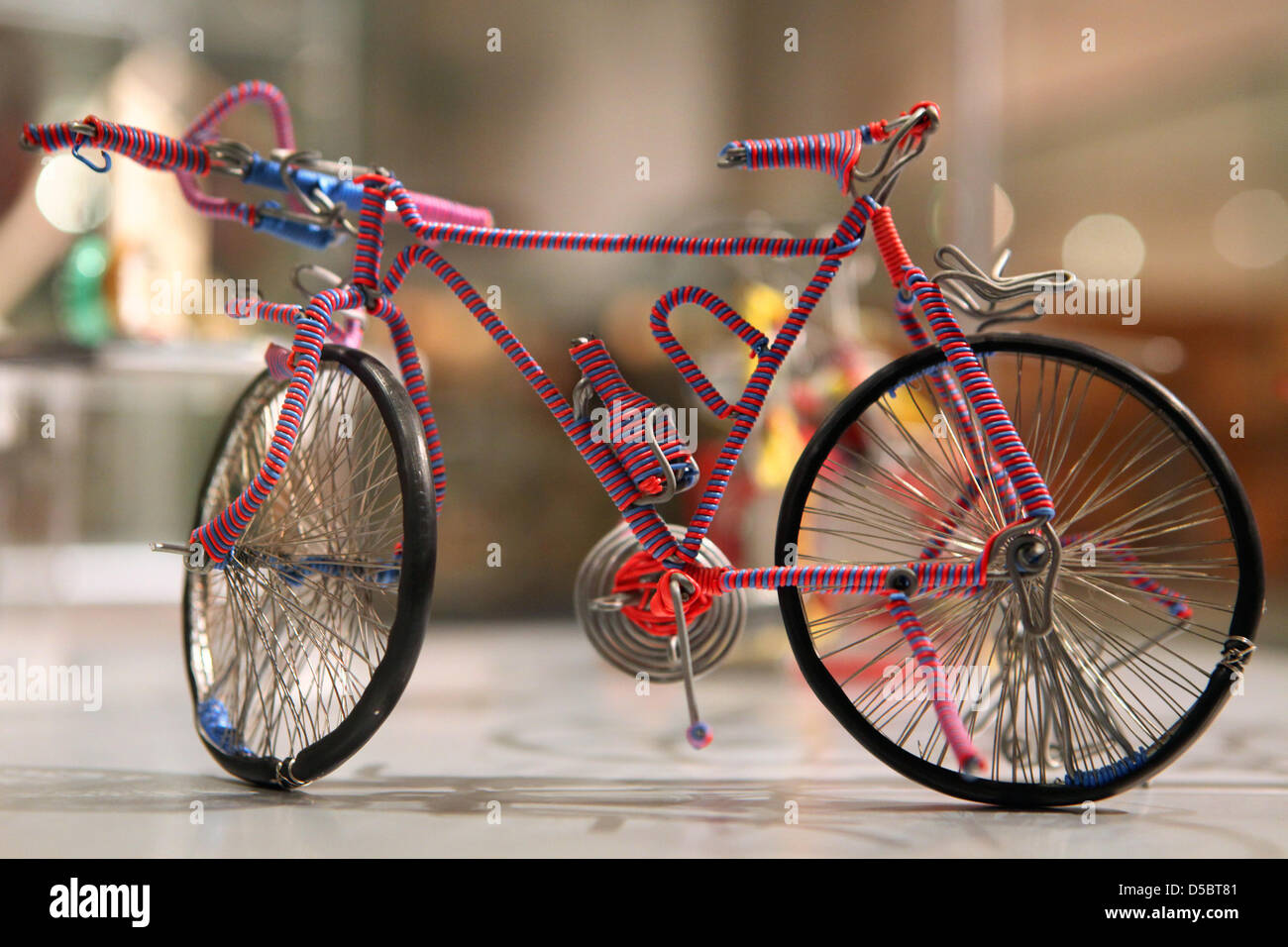 A bicycle made of wire by street children in Maputo, Mozambique is on ...