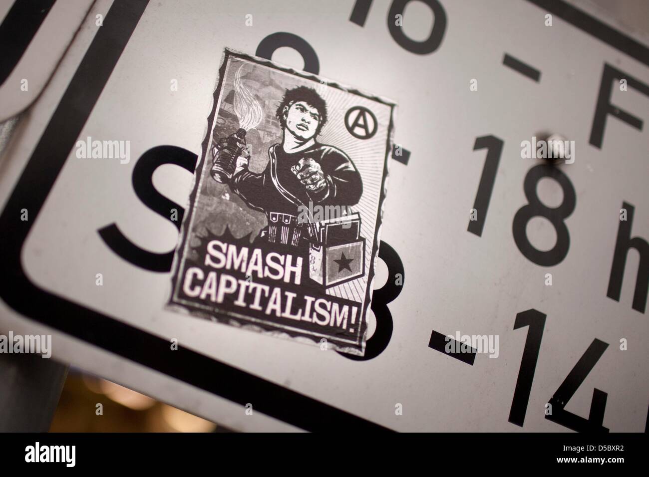 A sticker with the picture of a man with a burning Molotov cocktail and ...