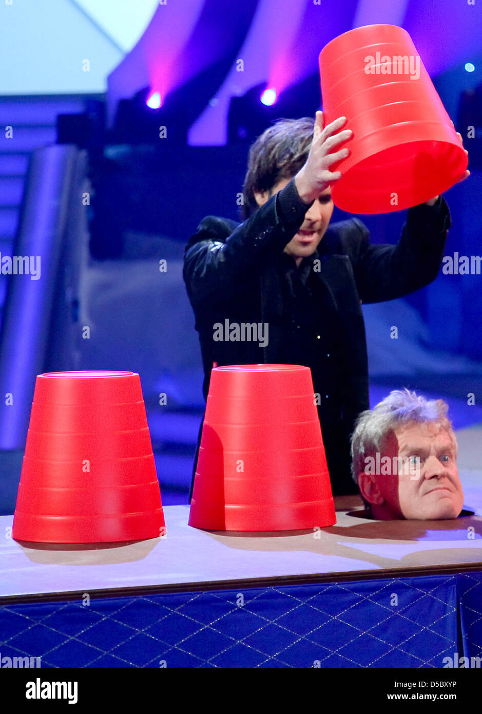 Magician Jan Rouven (top) and soccer legend Sepp Maier performs at the ...