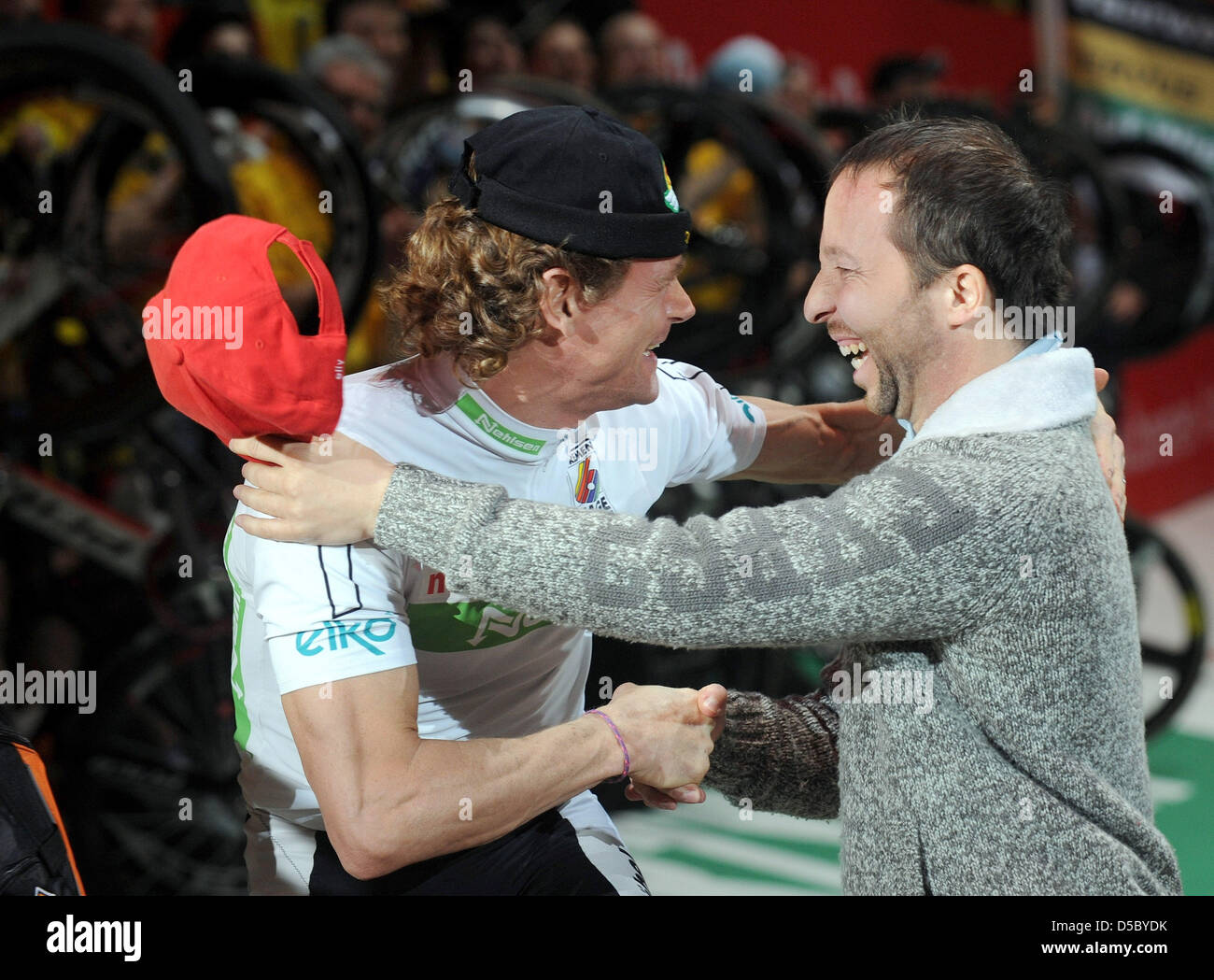 Swiss cyclist Bruno Risi is hugged by Swiss artist DJ Bobo as says ...