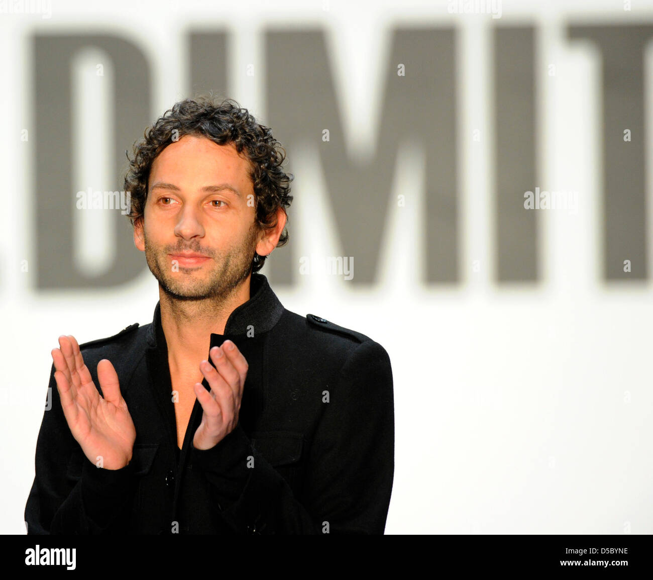 Fashion designer Dimitri Panagiotopoulos thanks the audience after the ...