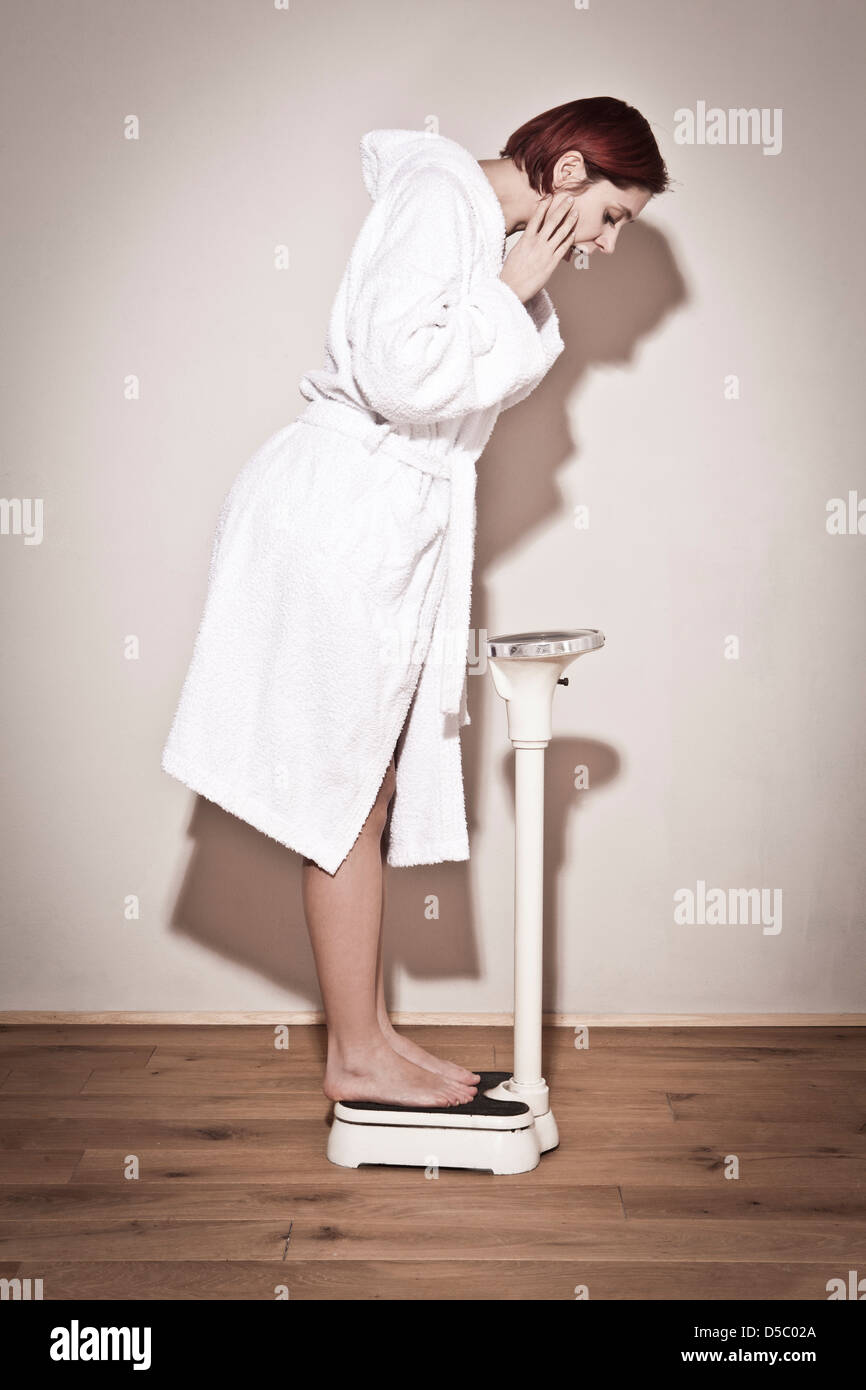Person on scales hi-res stock photography and images - Alamy