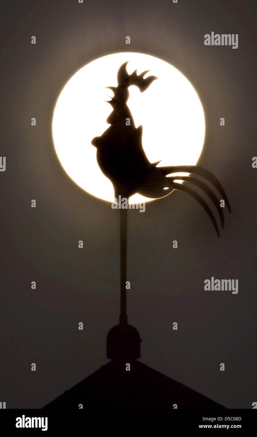 For a short period of time the sun appears behind a weathercock in ...