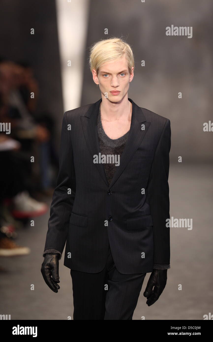A model takes to the catwalk wearing a creation of the Cerruti's fall ...