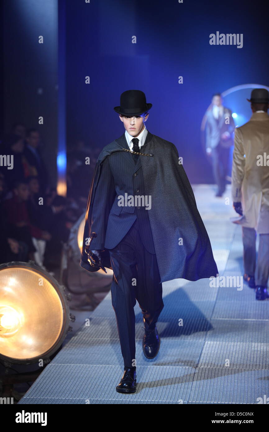A model takes to the catwalk wearing a creation of the John Galliano's ...