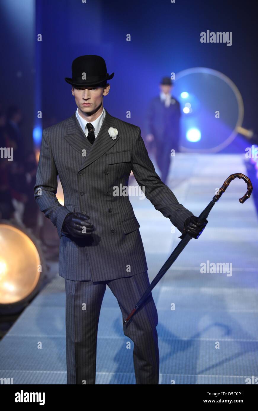 A model takes to the catwalk wearing a creation of the John Galliano's ...