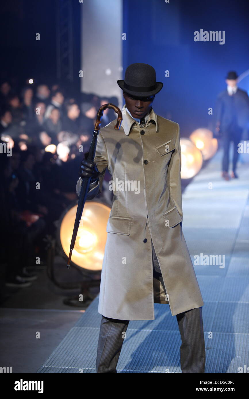 A model takes to the catwalk wearing a creation of the John Galliano's ...