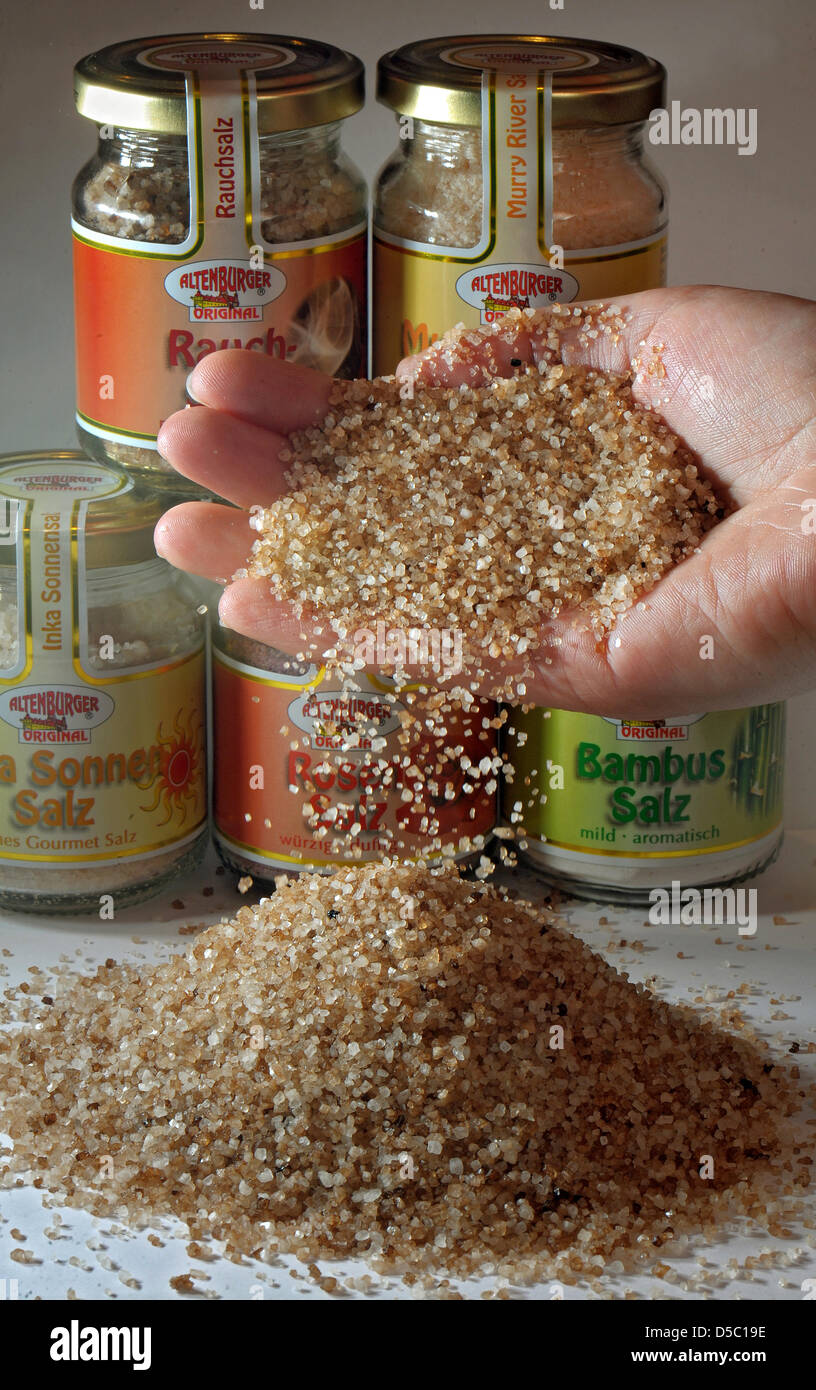 An employee of Mustard & Delicatessen e.K lets spicy smoked salt ...