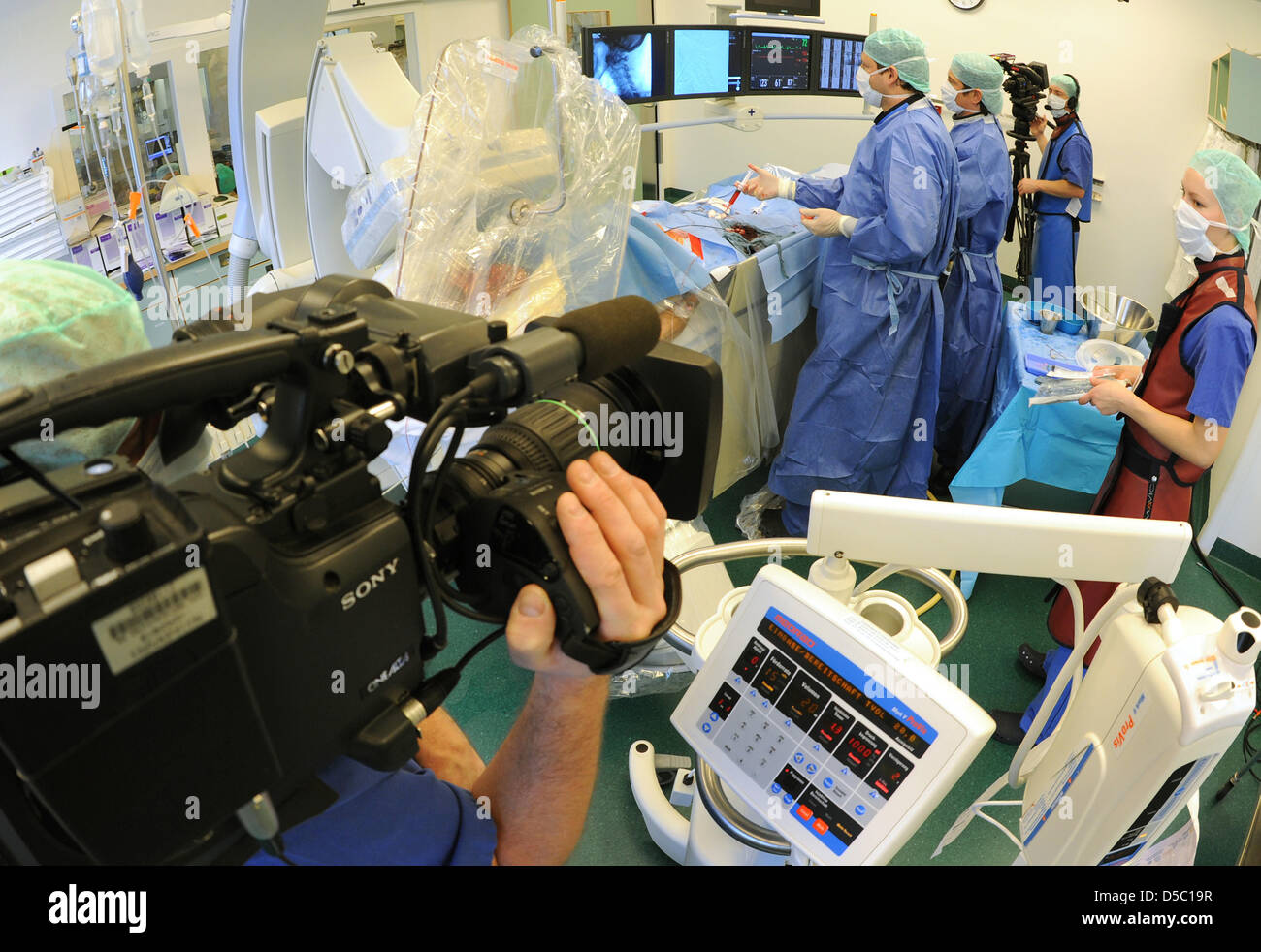 A Belgian camera crew films a carotid artery surgery performed by chief ...