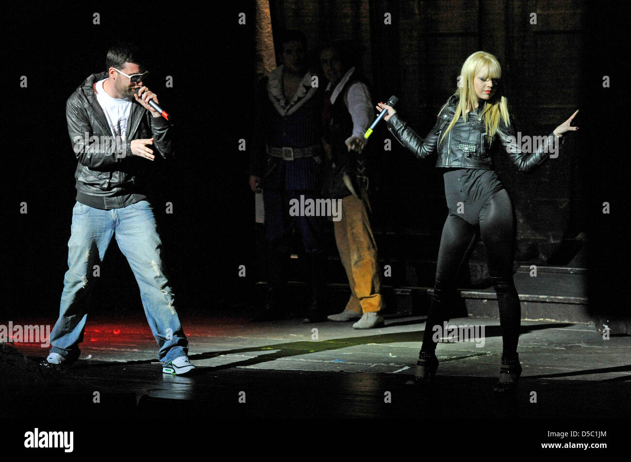German rapper Sido (L) and a female singer perform during an almost ...