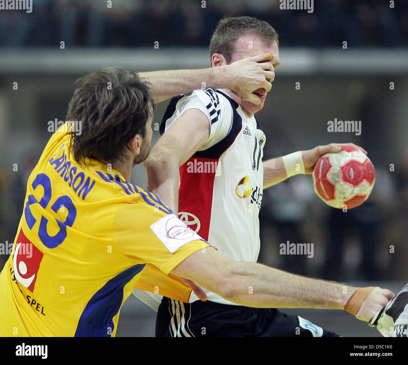 Germany's Holger Glandorf (R) and Sweden's Fredrik Larsson vie for the ...