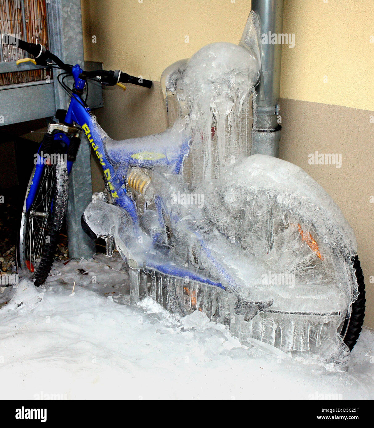 A bicycle covered with ice stands in a yard in Magdeburg, Germany, 26 ...