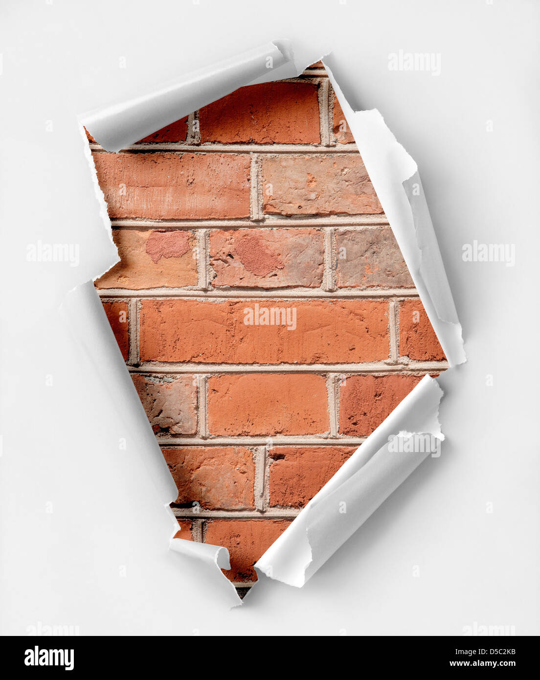Hole ripped paper. Brick wall background Stock Photo - Alamy