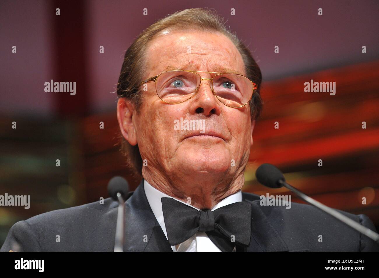 British actor Roger Moore holds an acceptance speech during the award ...