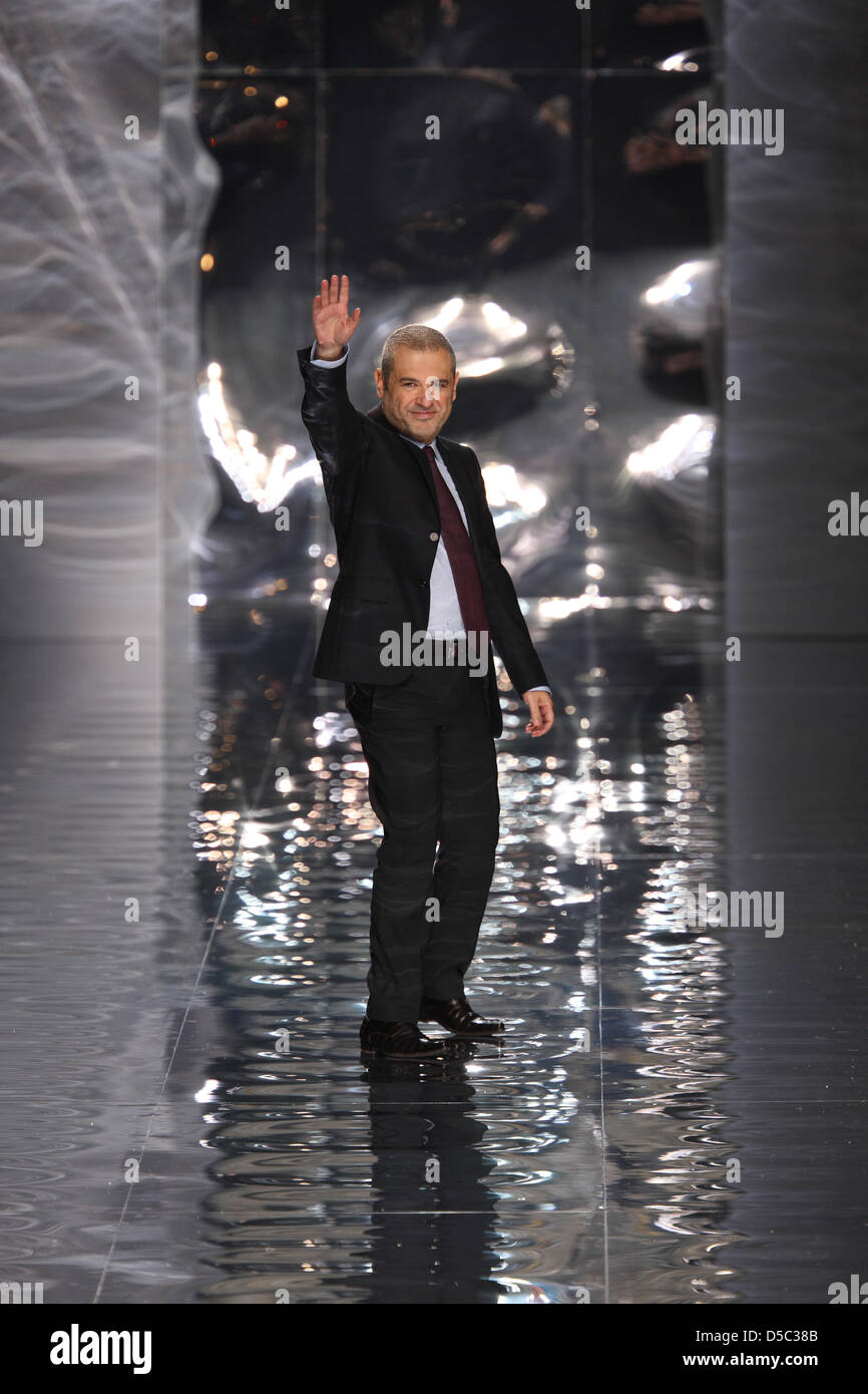 Designer Elie Saab appears on stage after his Haute Couture fashion ...