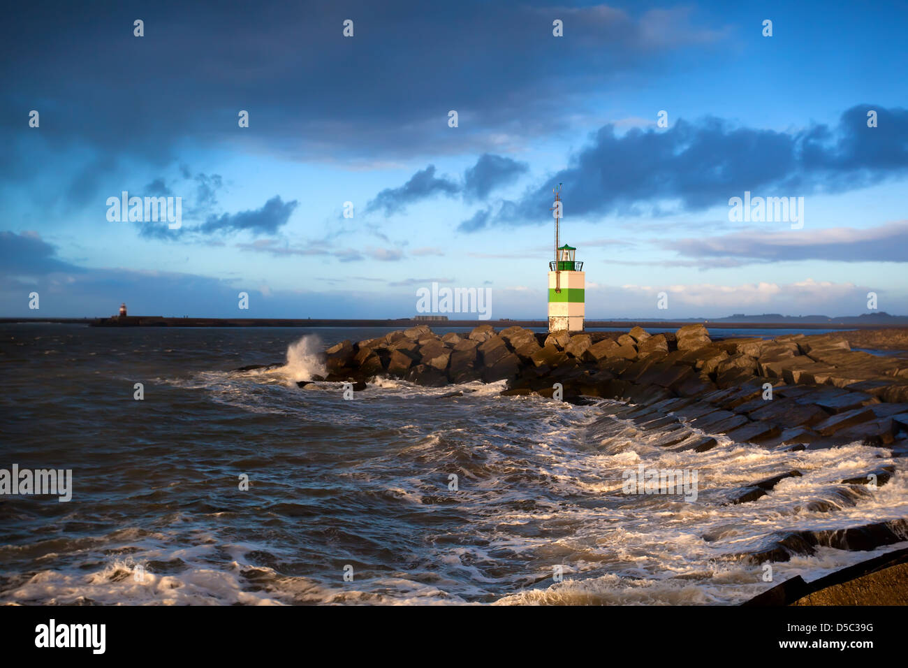 green lighthouse on North sea, Ijmuiden before sunset Stock Photo - Alamy