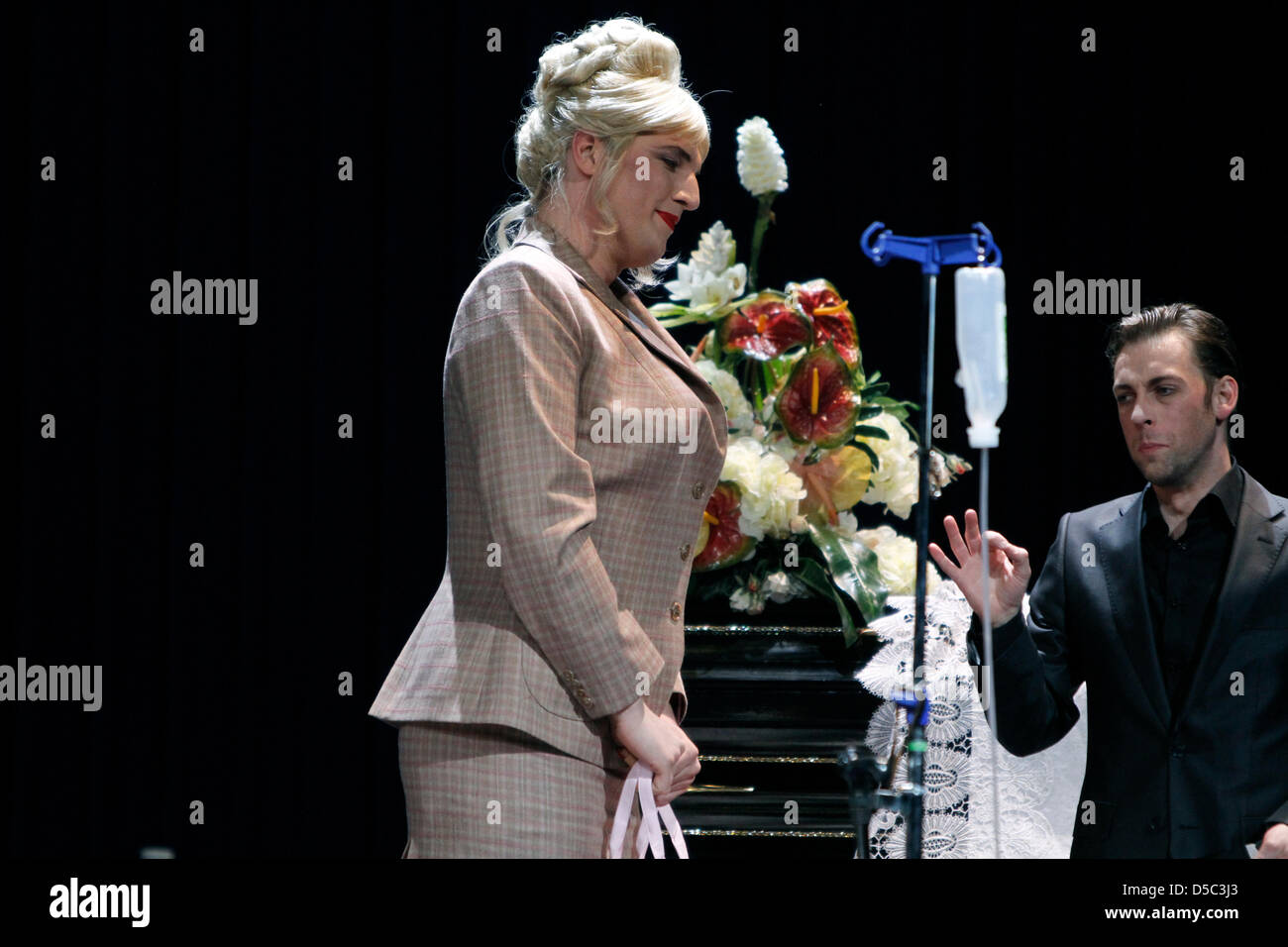 German bass Ingo Witzke as A notary (L) and German baritone Guenter ...