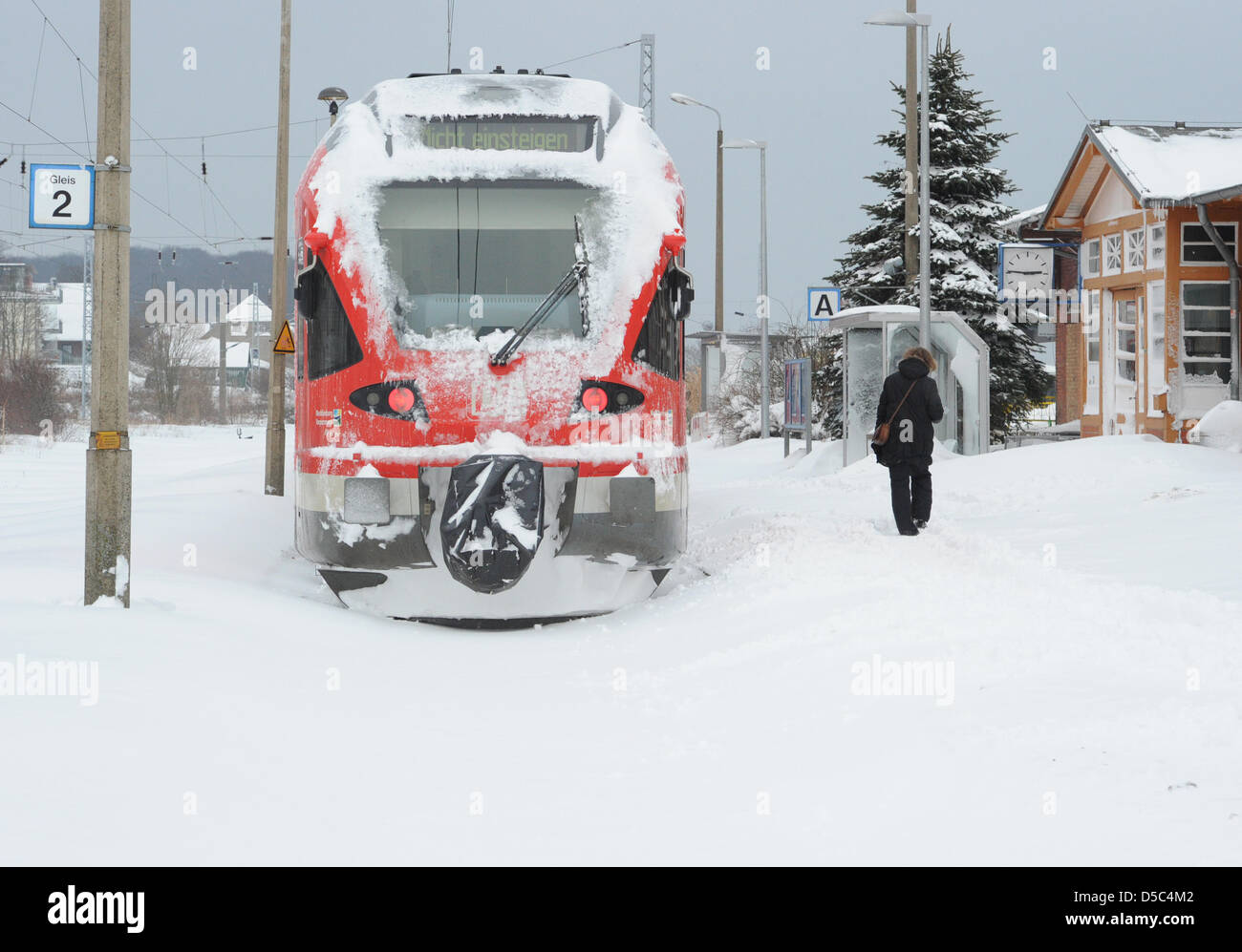 A train is stuck in snow at the station Sassnitz on the island Rugia ...