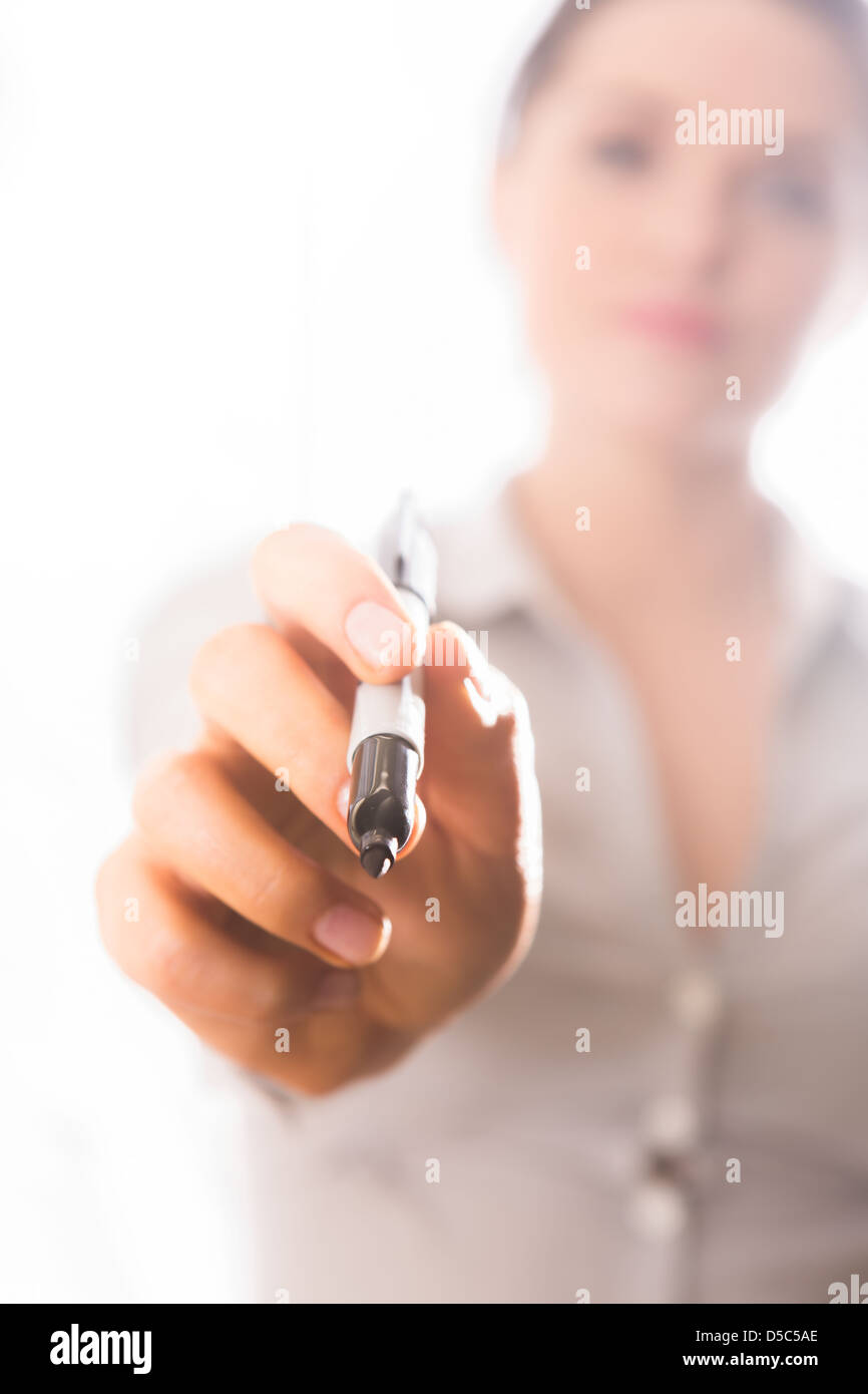 Young professional business women female with pen and pad in an office ...