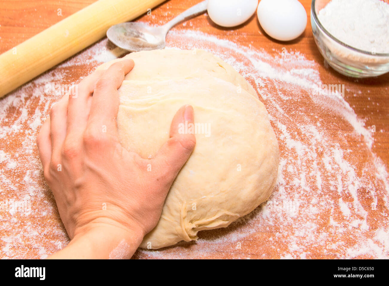 Woman's hand working the dough. Process of bread cooking close up Stock ...