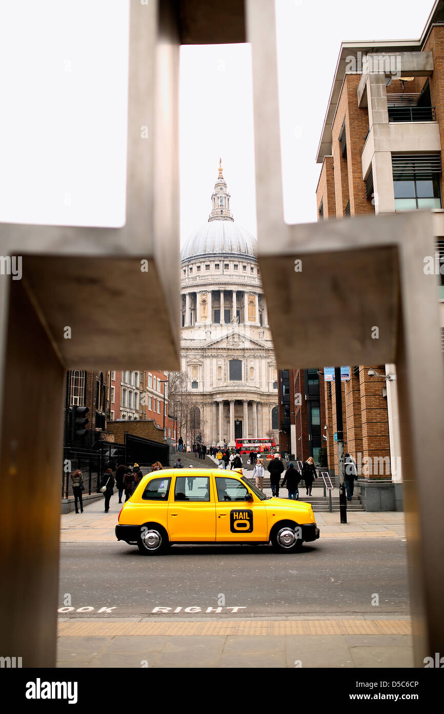 yellow London cab with St Paul's Stock Photo - Alamy