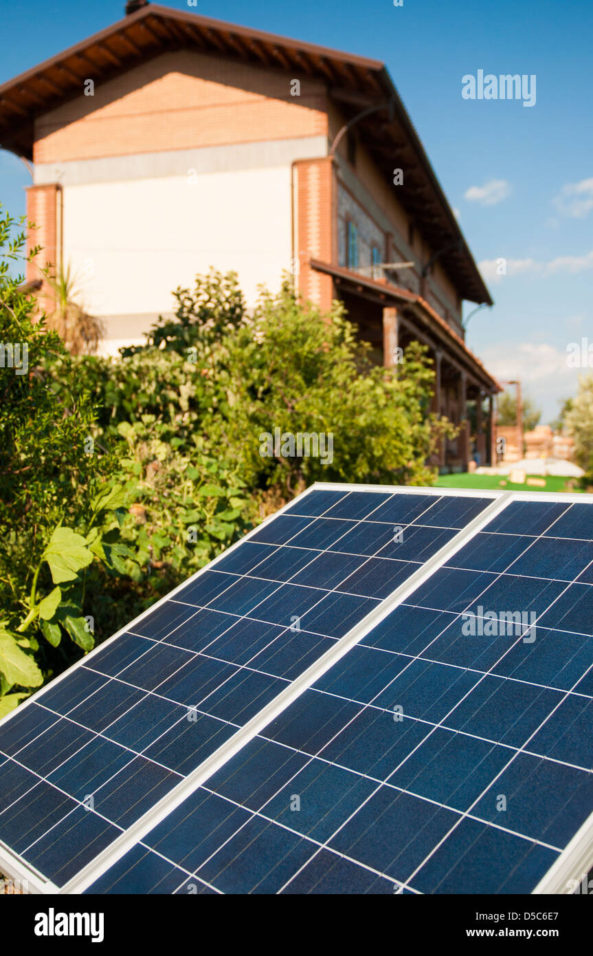 Solar panel reflecting the sun and the cloudless blue sky Stock Photo ...