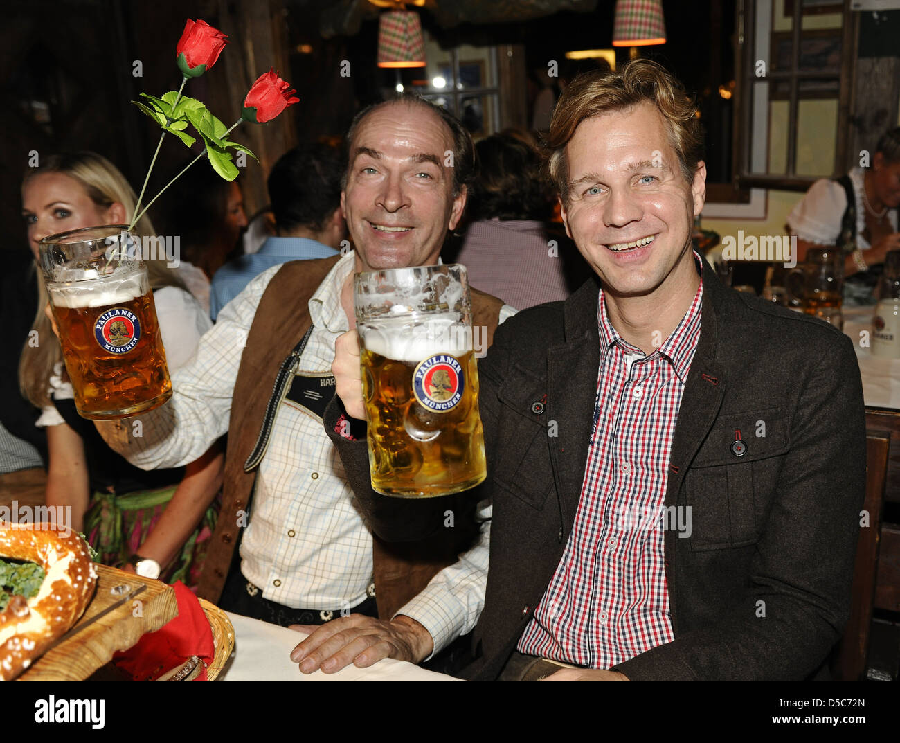 Herbert Knaup and Thomas Heinze at Oktoberfest 2011. Munich, Germany ...
