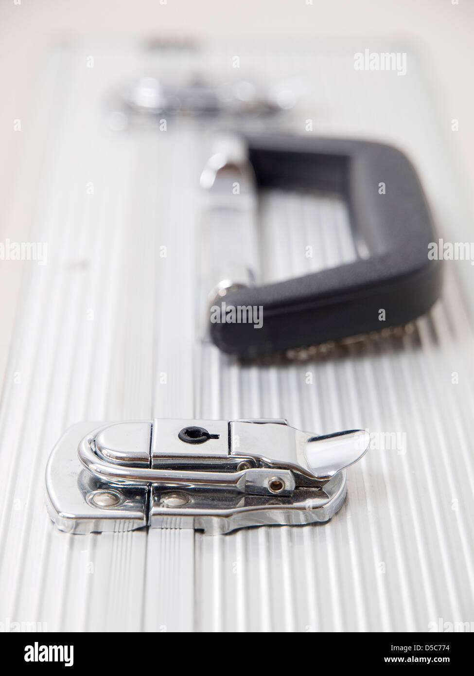 Detail closure briefcase on white background Stock Photo - Alamy