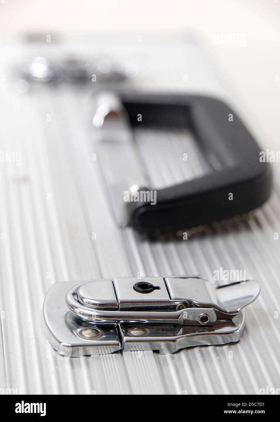 Detail closure briefcase on white background Stock Photo - Alamy