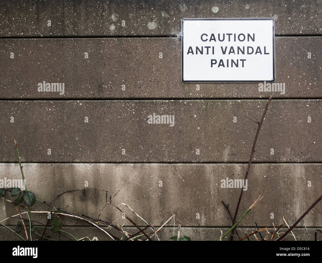 England, West Midlands, Caution Anti Vandal Paint sign on a concrete ...
