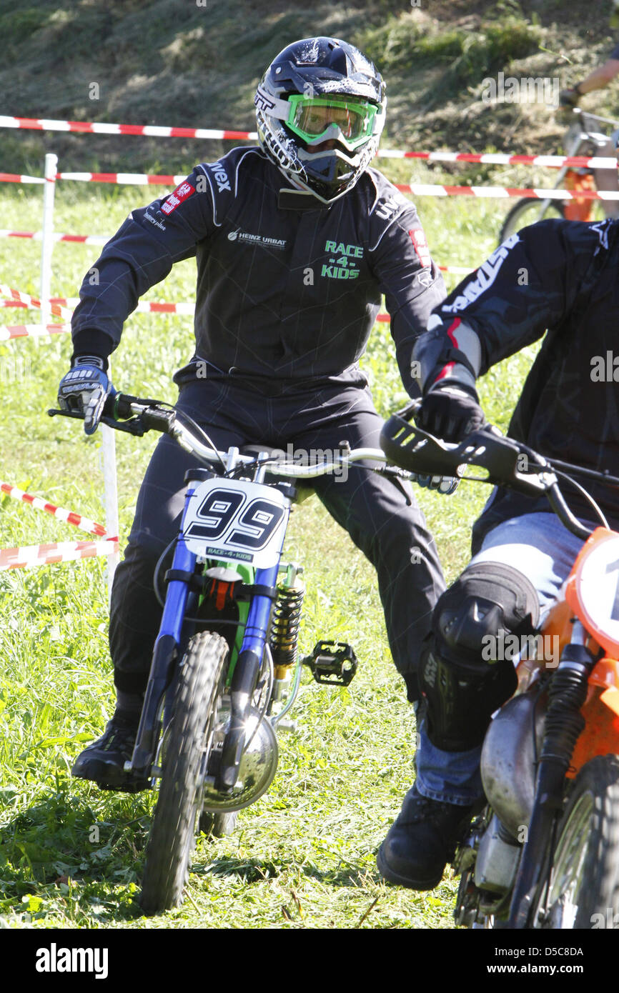 Former Tour de France winner Jan Ullrich taking part in a mofa race ...