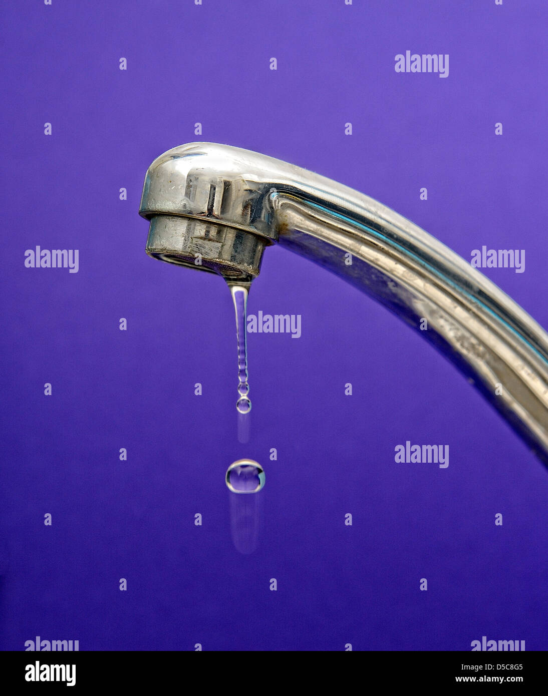 Water droplets falling from a kitchen tap Stock Photo - Alamy