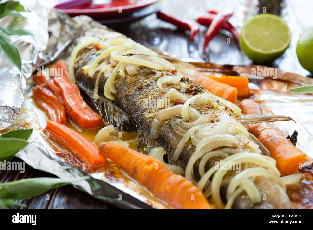 freshwater fish baked in foil, closeup Stock Photo - Alamy
