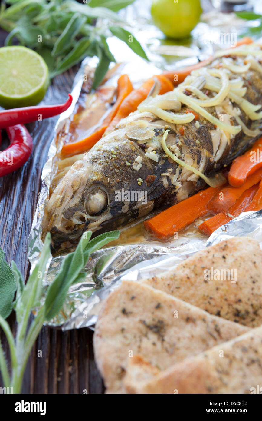 river fish with vegetables baked in foil, closeup Stock Photo - Alamy
