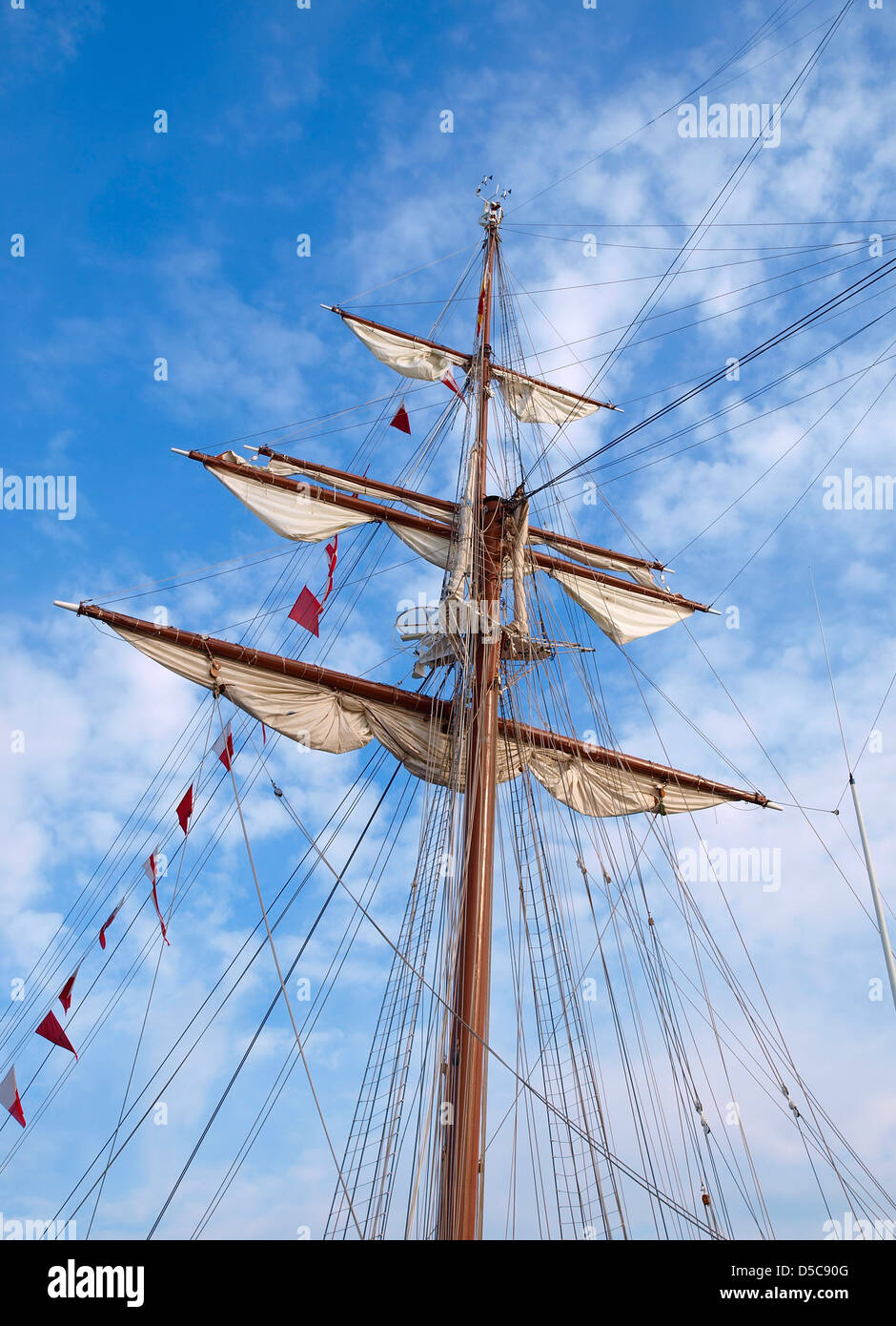 Mast of a ship with furled sails Stock Photo - Alamy