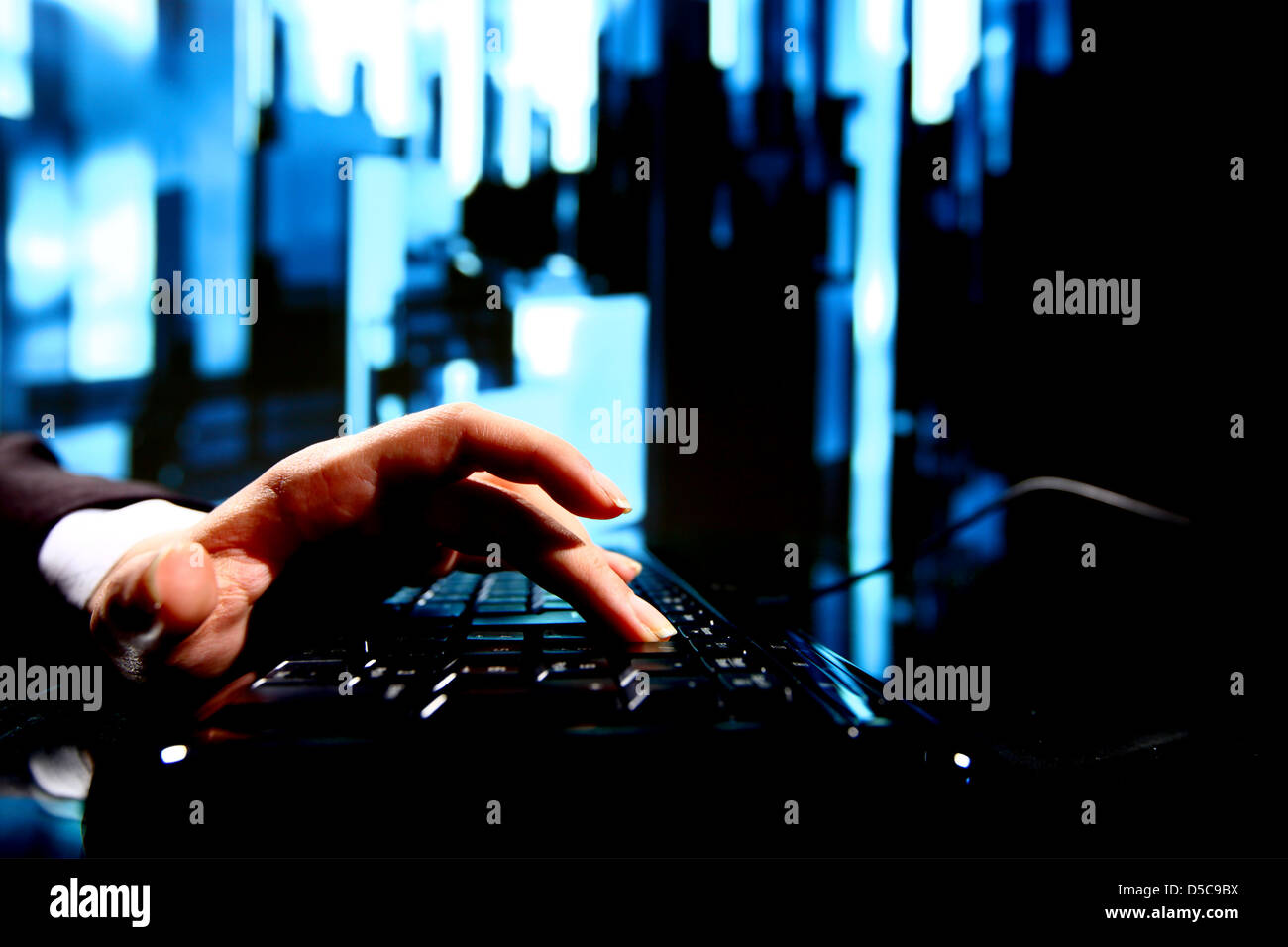 reseller work on keyboard skyscrapers on background Stock Photo - Alamy