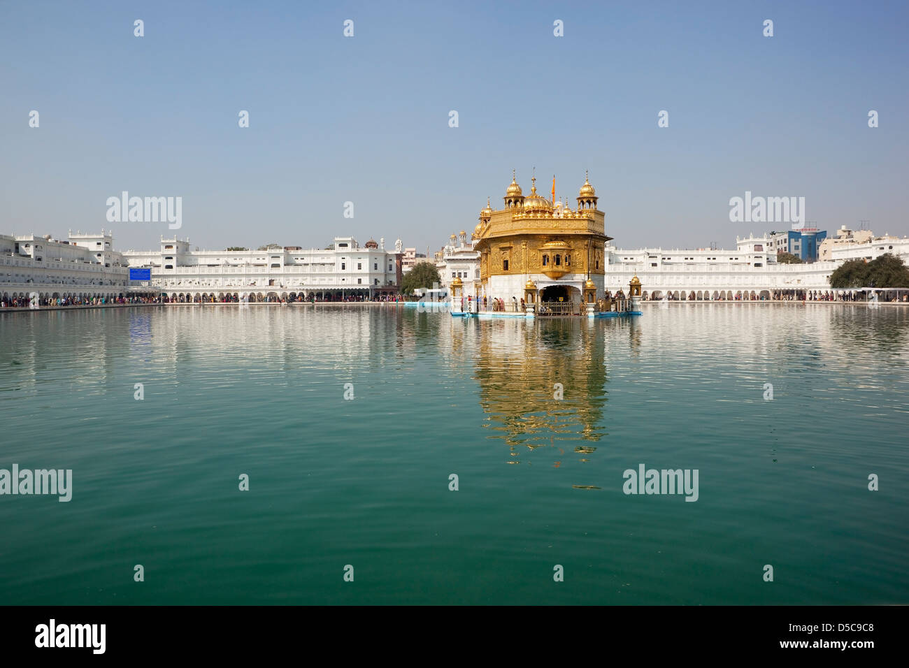 The Golden temple of Amritsar, viewed across the holy pool Stock Photo ...