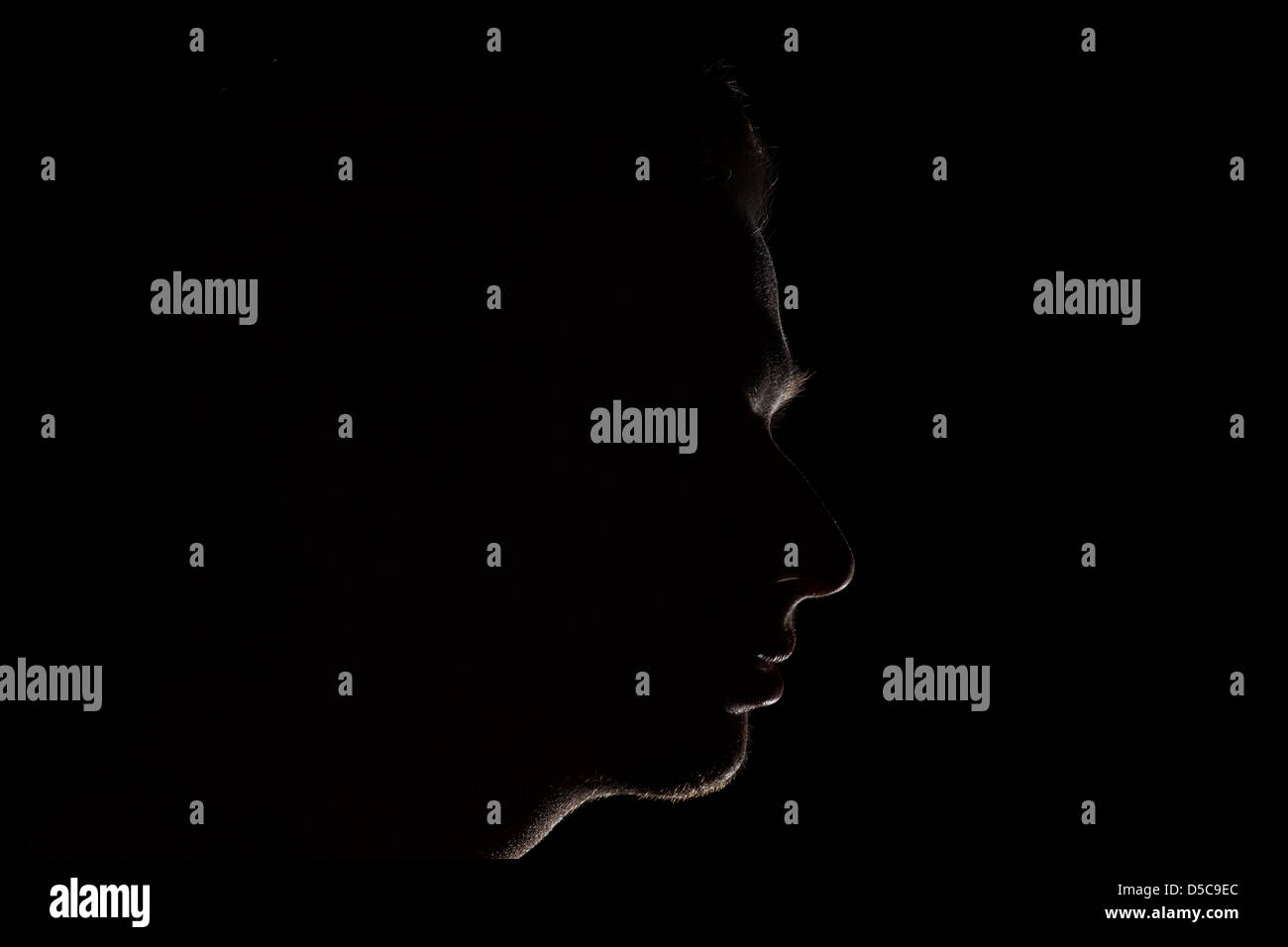 low key portrait silhouette of man looking or thinking Stock Photo - Alamy