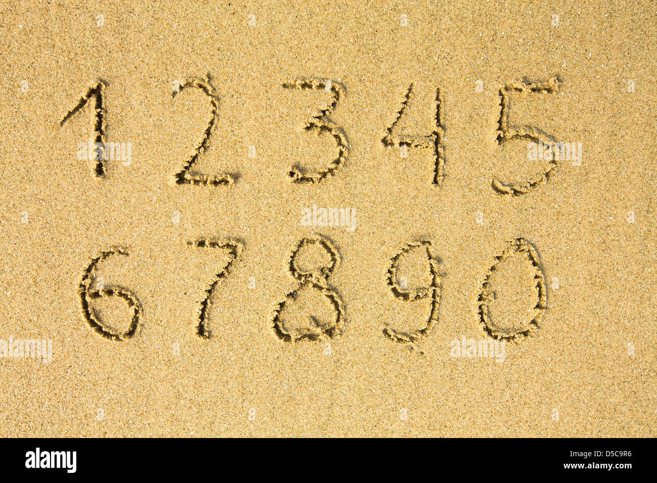 Numbers written on sand hi-res stock photography and images - Alamy