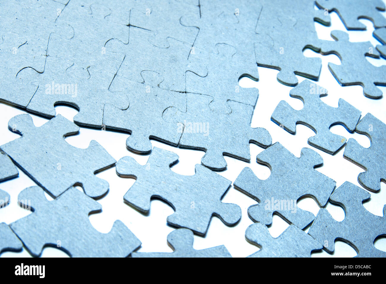 Pieces of puzzle close up Stock Photo - Alamy