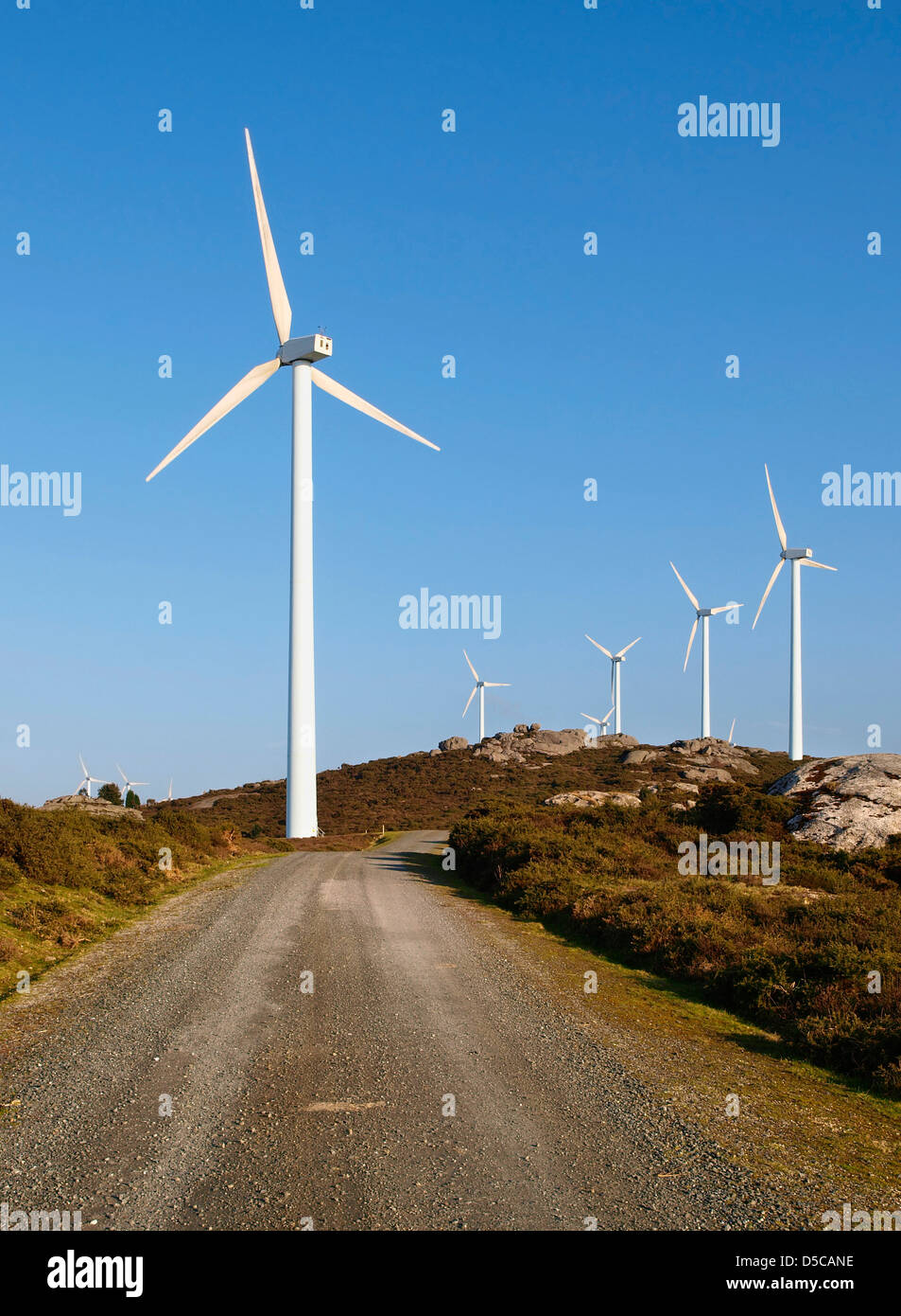 Wind turbines in a landscape with a trail Stock Photo - Alamy